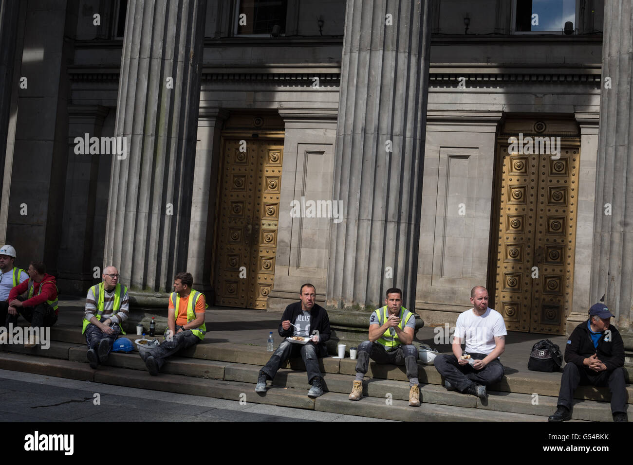Construction workers sitting on a tea break outside the Gallery of ...
