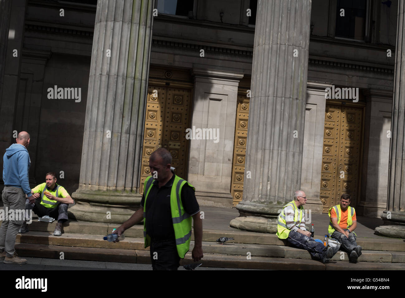 Construction workers sitting on a tea break outside the Gallery of ...