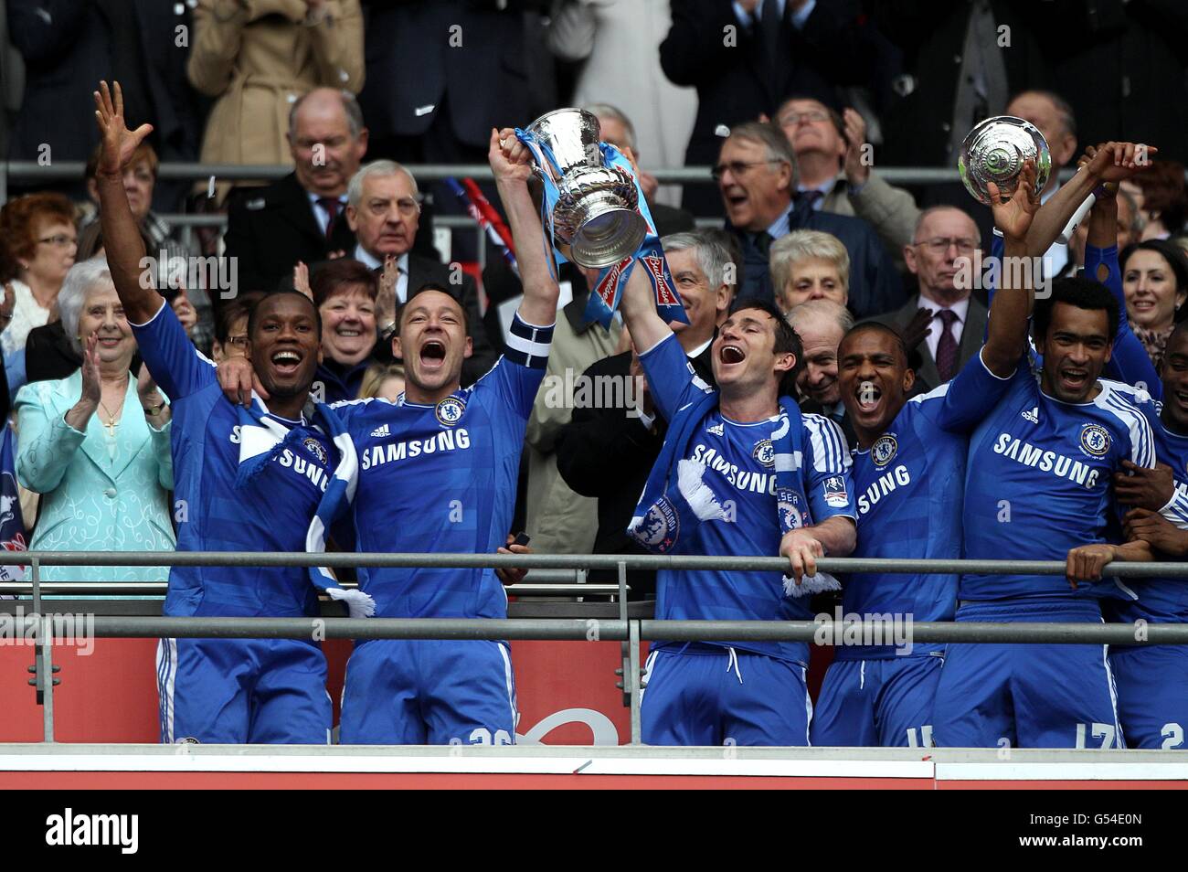 Chelsea's John Terry (second left) and Frank Lampard (centre) lift the ...