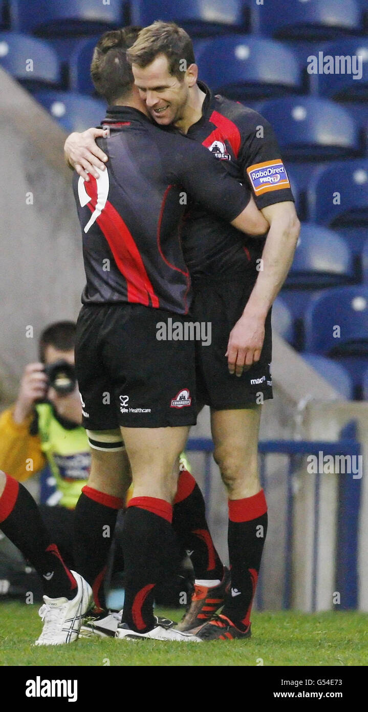 Edinburgh's Chris Paterson celebrates his try with team mate Chris Leck ...