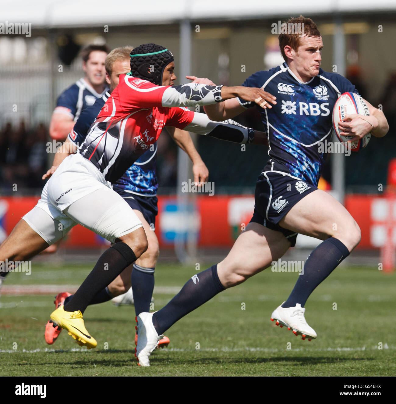 Scotland's Michael Fedo (right) is tackled by Kenya's Biko Adema during ...