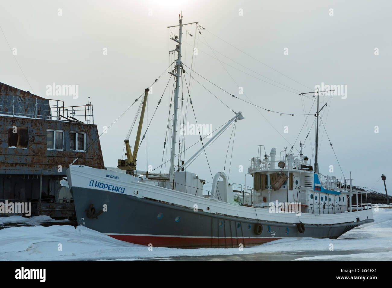 Ship in frozen lake covered with snow in winter evening Stock Photo - Alamy