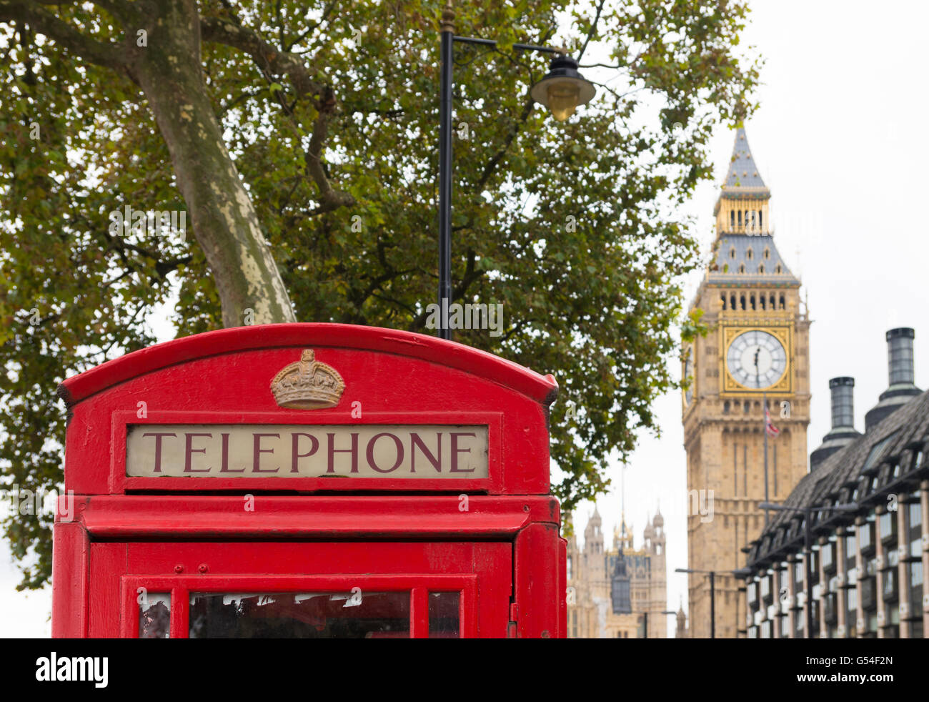 typically english red phone booth in london with the Big Ben in the ...