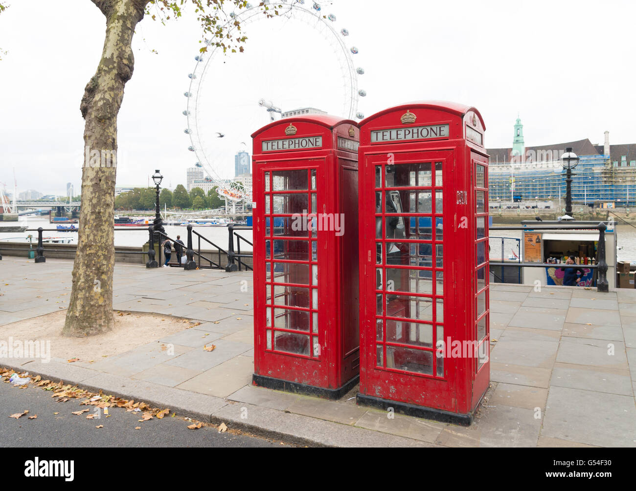 LONDON - OCTOBER 19, 2015: Two typically red english phone booths with ...