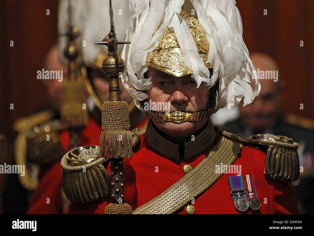 A member of the Royal Guard, awaits the arrival of Queen Elizabeth II ...