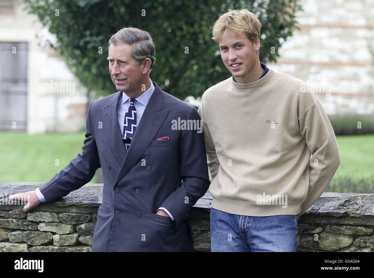 Prince William stands with his father in the gardens of their home at ...