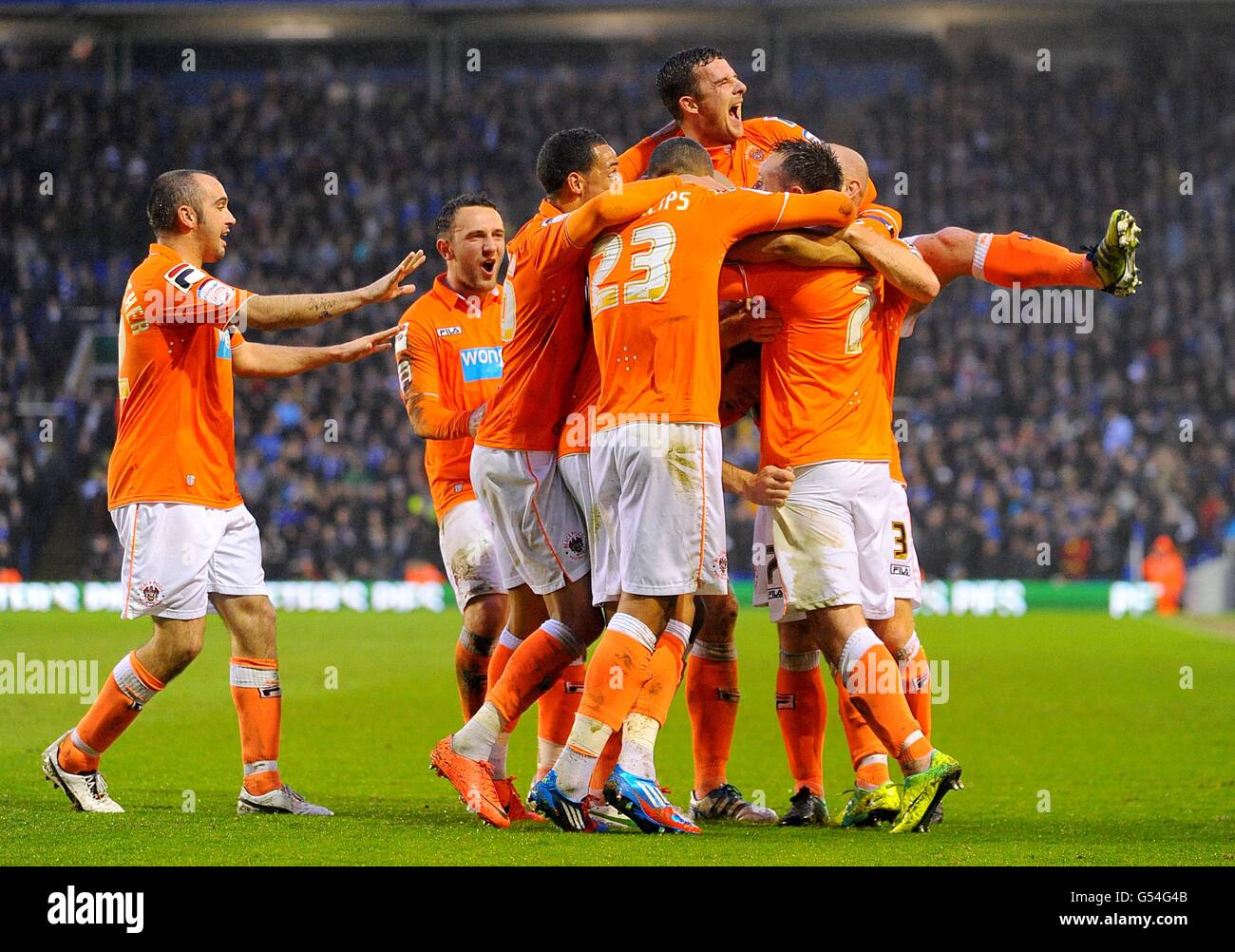 Blackpool's Stephen Dobbie (second right) is mobbed by team-mates after ...