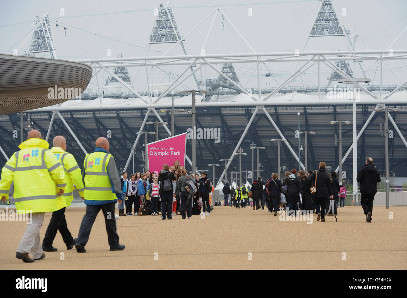 Security guards patrol the Olympic Park as spectators arrive for the ...