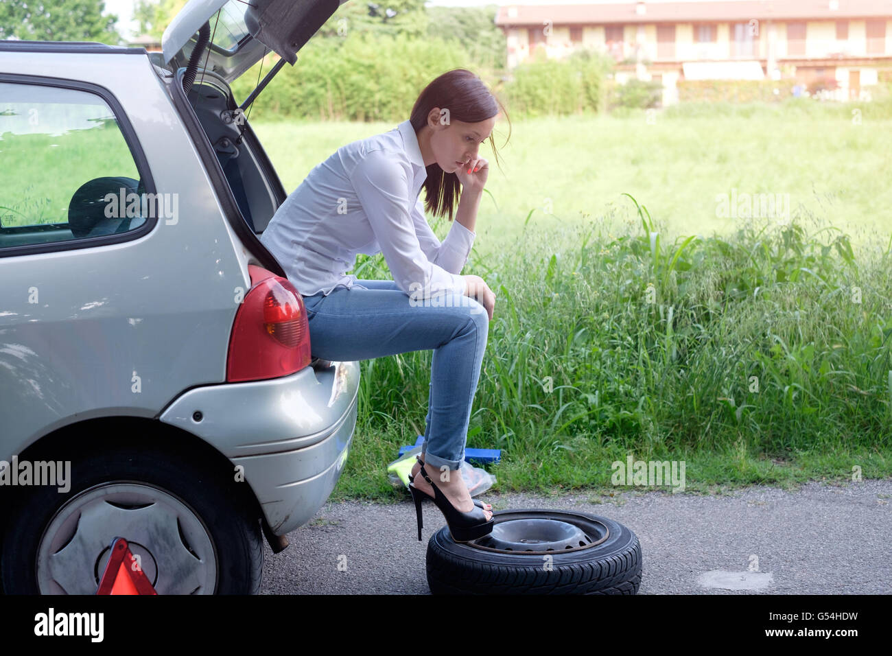 Flat tire woman hi-res stock photography and images - Alamy