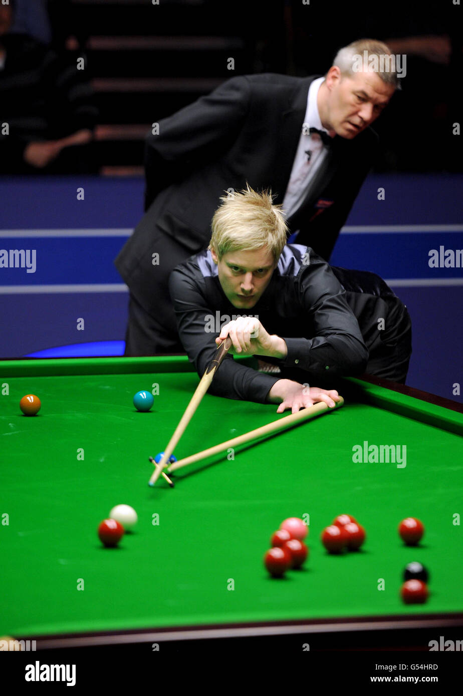 Referee Jan Verhaas looks on as Australia's Neil Robertson plays a shot ...