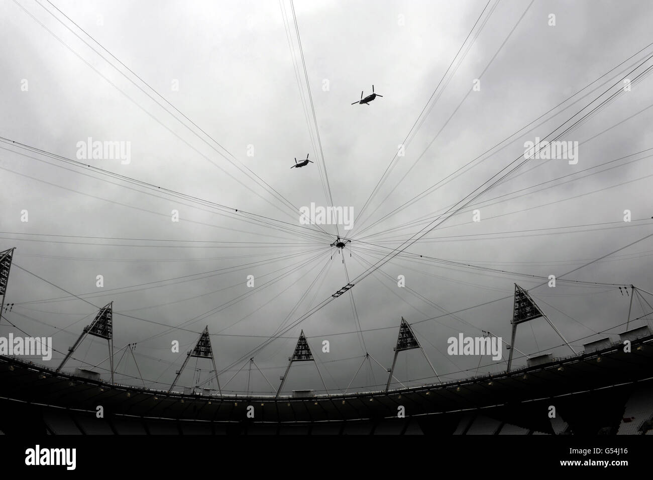 Two Chinook helicopters fly over the Olympic Stadium, London Stock ...
