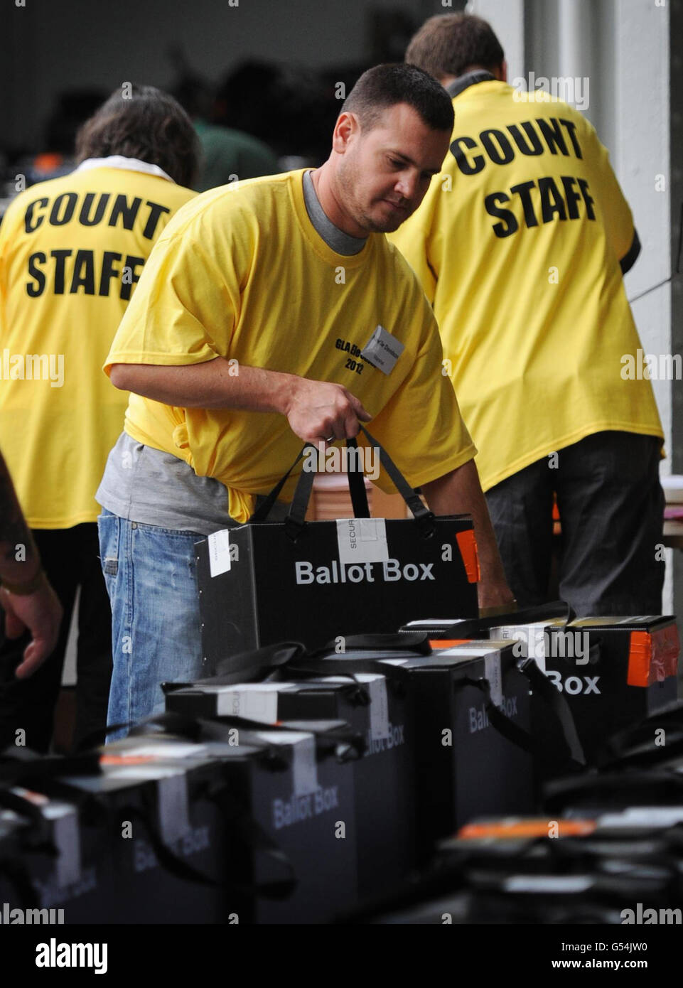 Counting staff at Olympia in London prepare to count the votes from ...