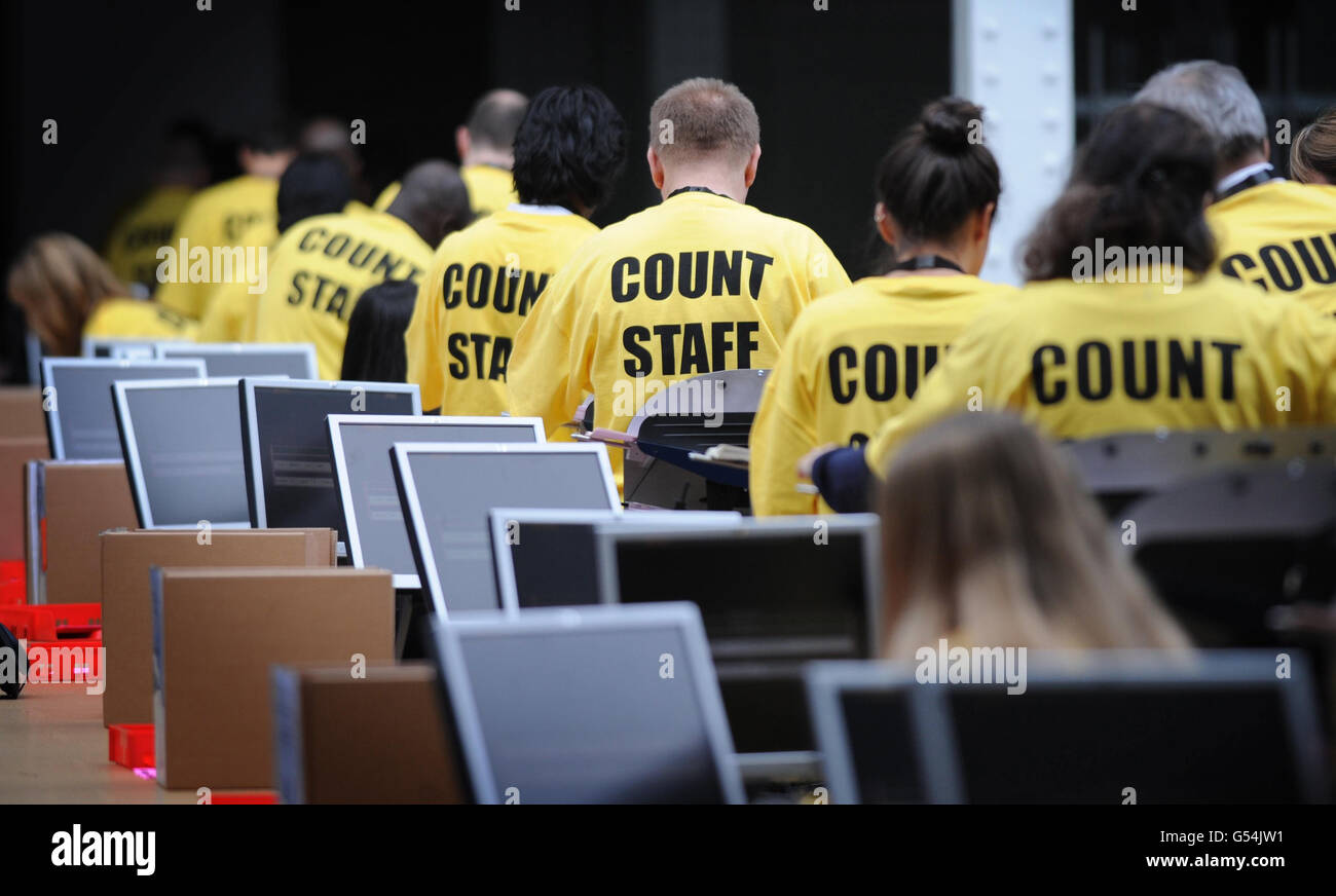 Counting staff at Olympia in London prepare to count the votes from ...