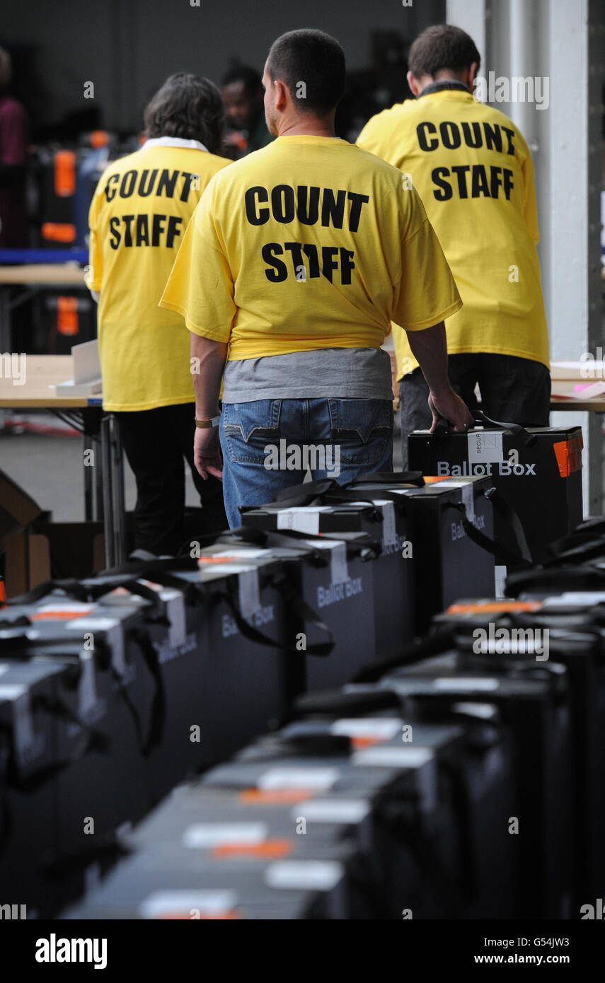 Counting staff at Olympia in London prepare to count the votes from ...