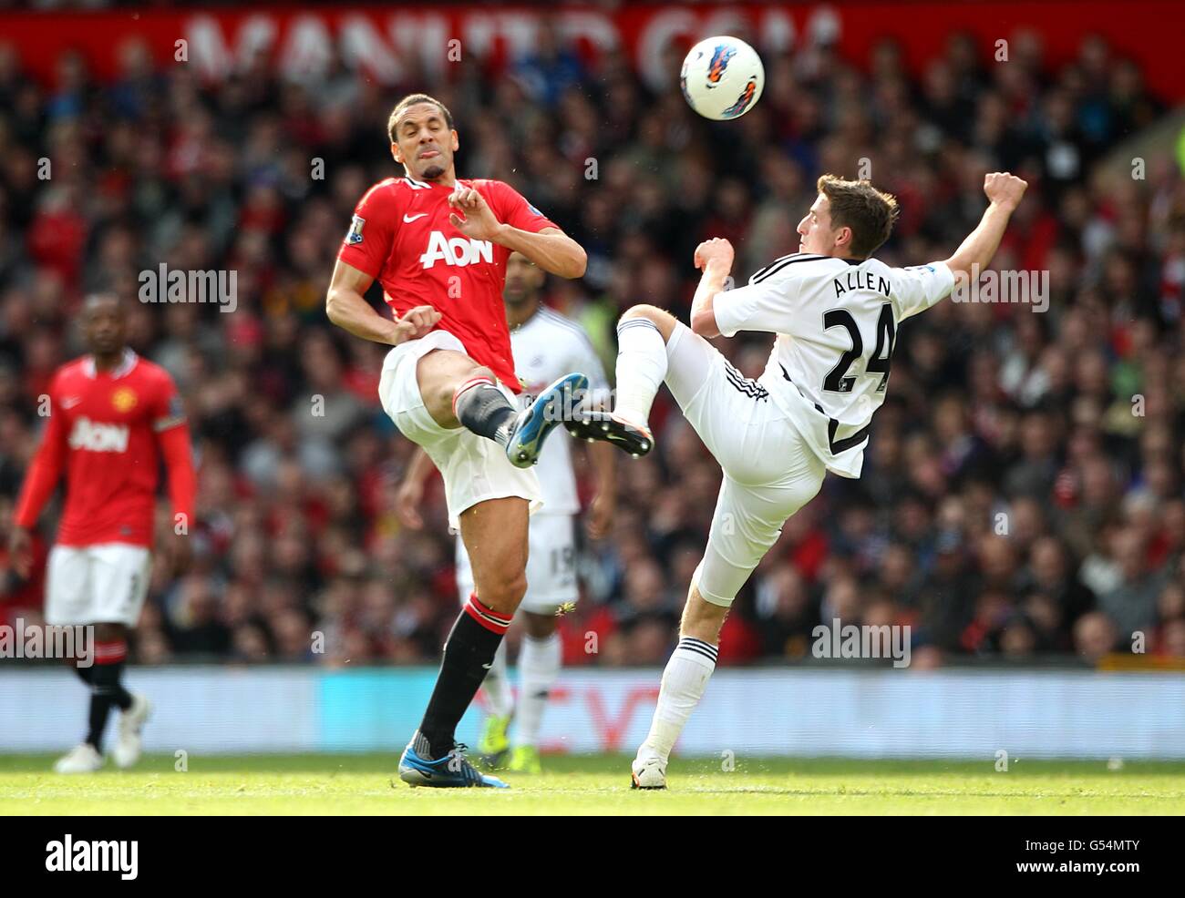 Manchester United's Rio Ferdinand (left) and Swansea City's Joe Allen ...