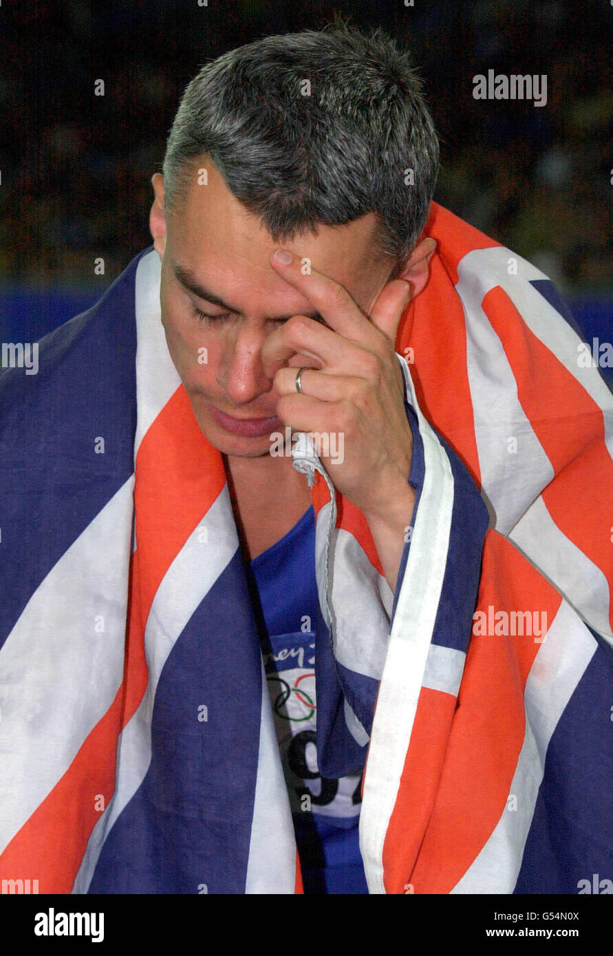 Great Britain's Jonathan Edwards is overcome with emotion after winning ...