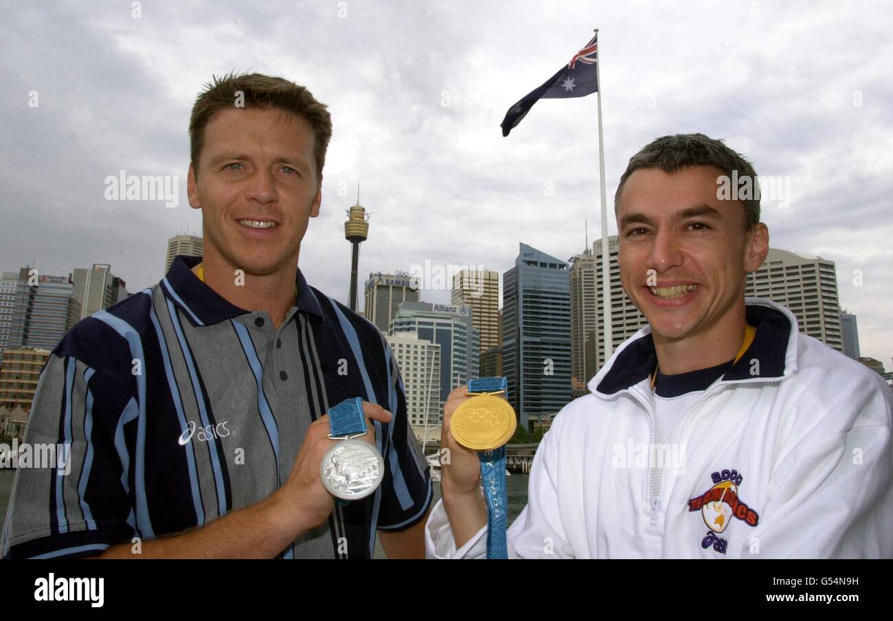 Great Britain's Olympic Gold medallist Jonathan Edwards (R) and team ...