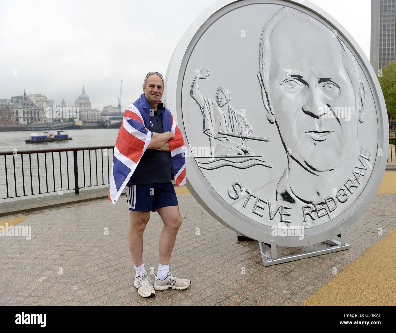 Sir Steve Redgrave stands in front of a giant medallion, featuring his ...
