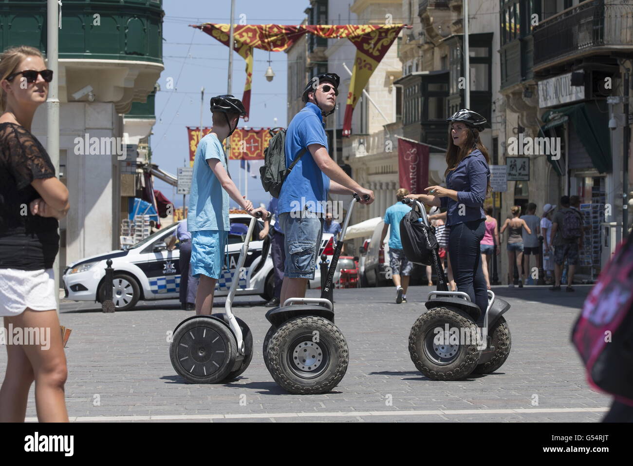 Segway drivers on a sightseeing tour near the Grandmaster's Palace ...