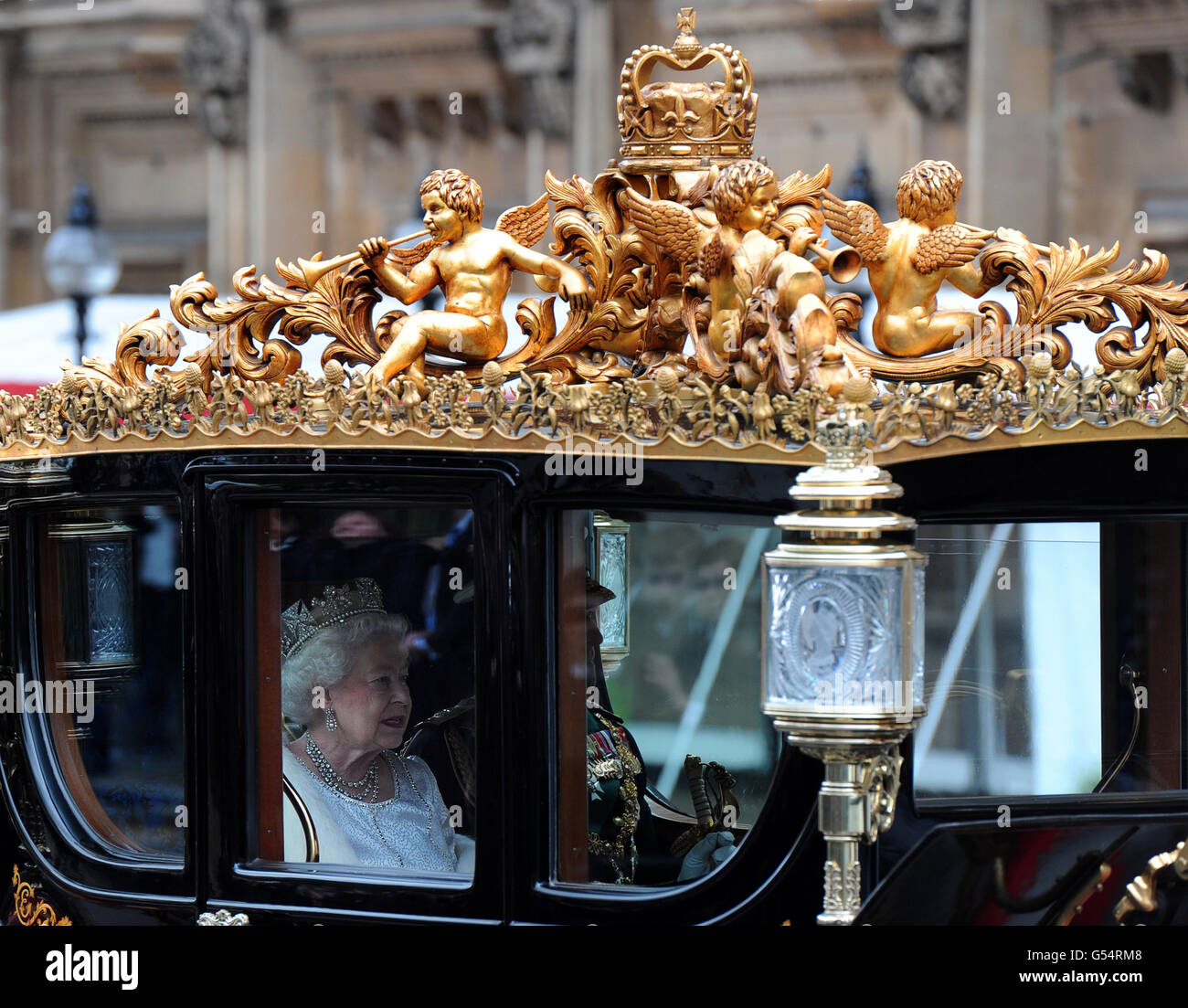 The carriage carrying Queen Elizabeth II and the Duke of Edinburgh ...