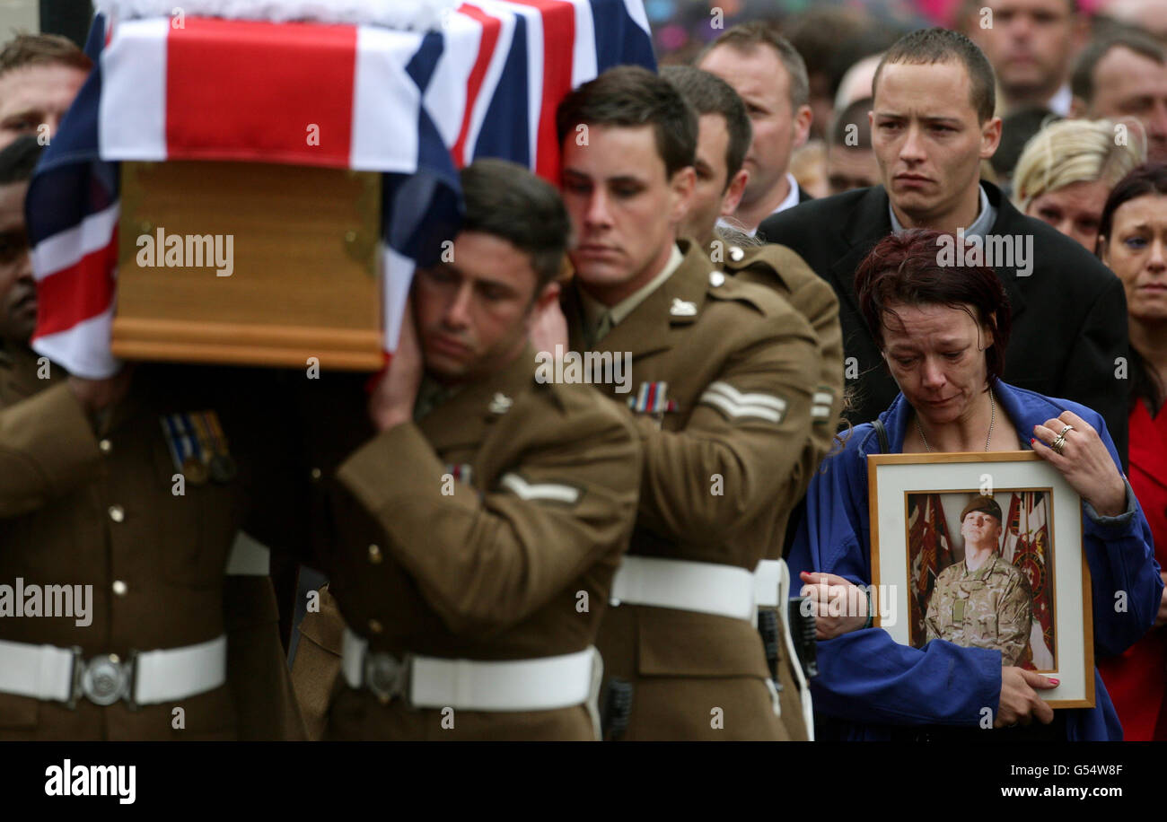Lisa billing carries a photograph of her son hi-res stock photography ...