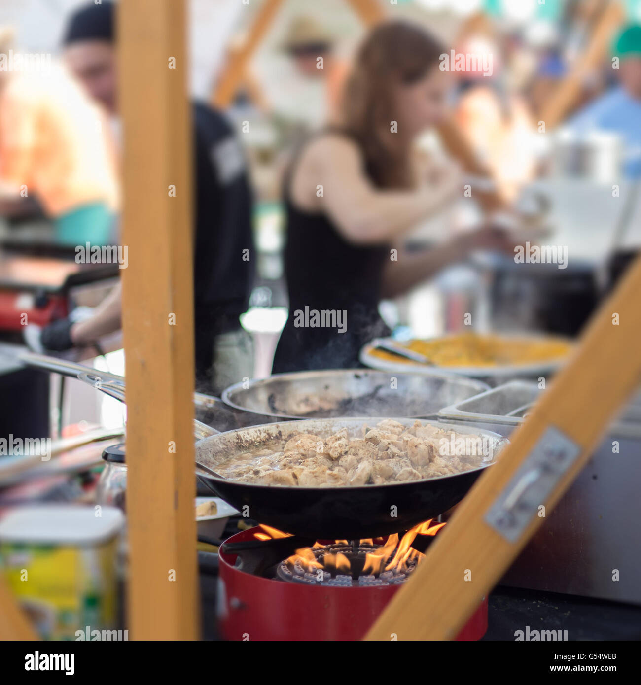Cheff cooking on outdoor street food festival Stock Photo - Alamy