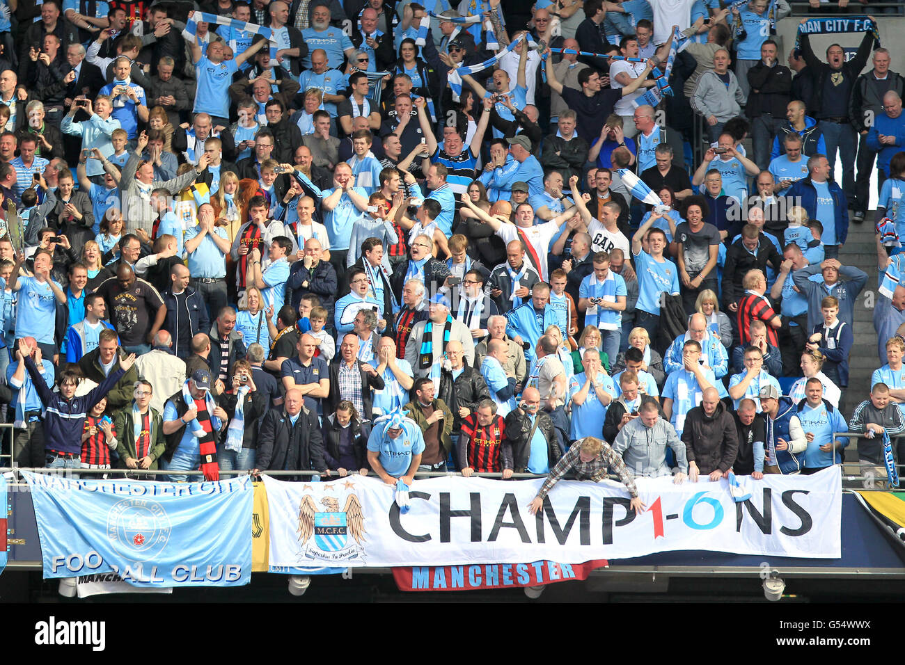 Manchester city fans with a champions banner in the stands hi-res stock ...