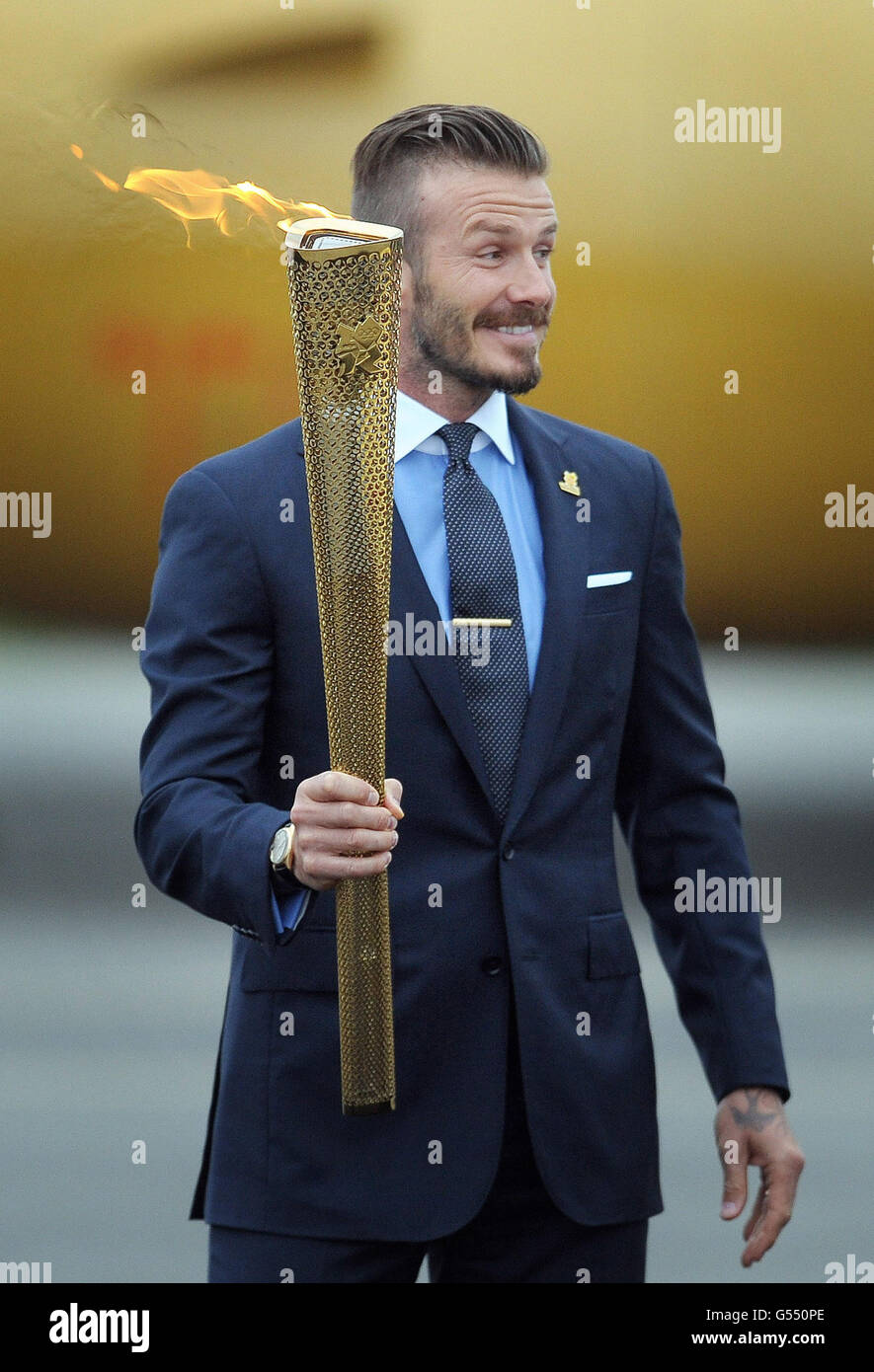 David Beckham with the torch during the ceremony to mark the arrival of ...