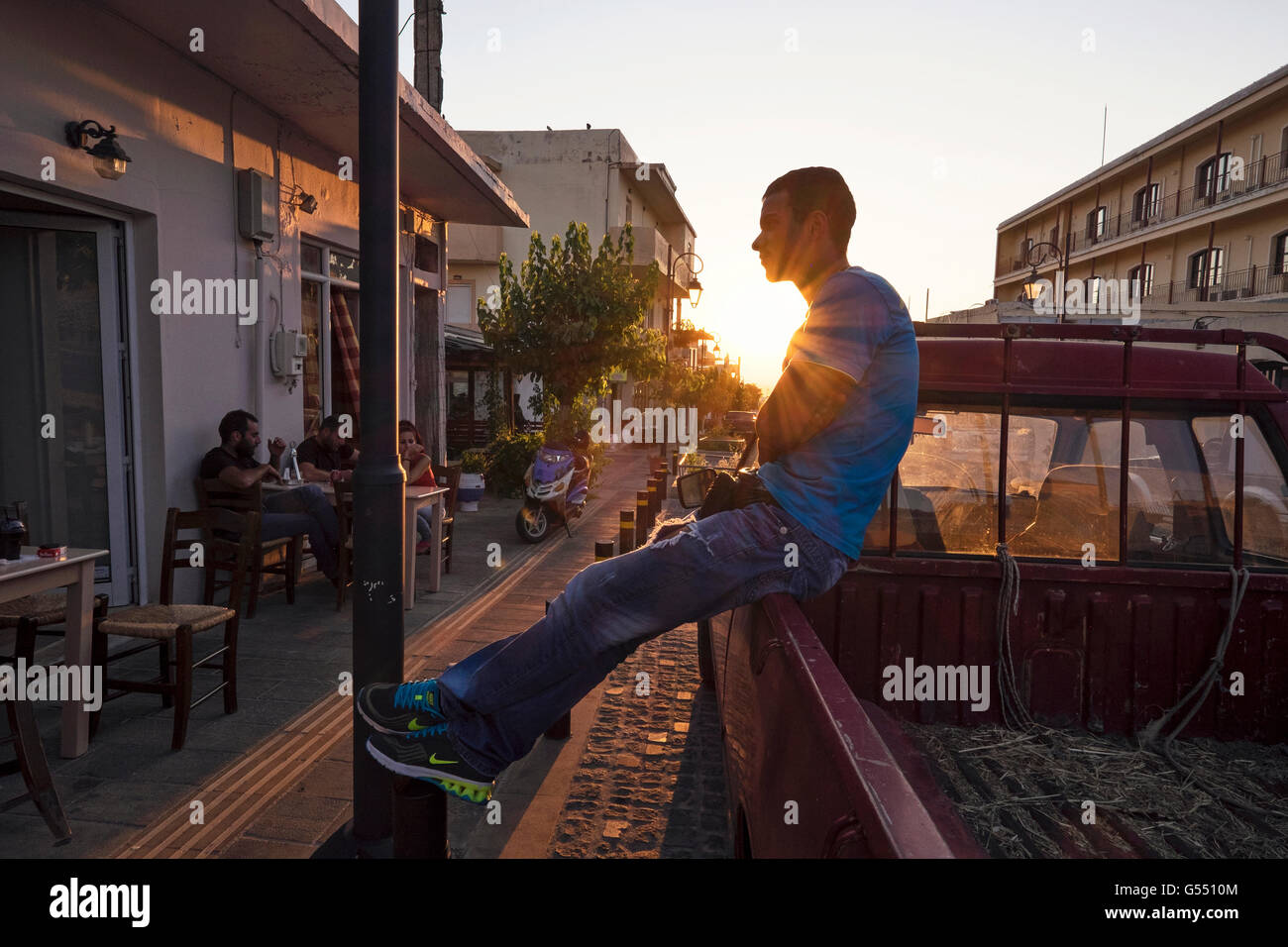 Young people relax in the village of Anogia, on the island of Crete in ...