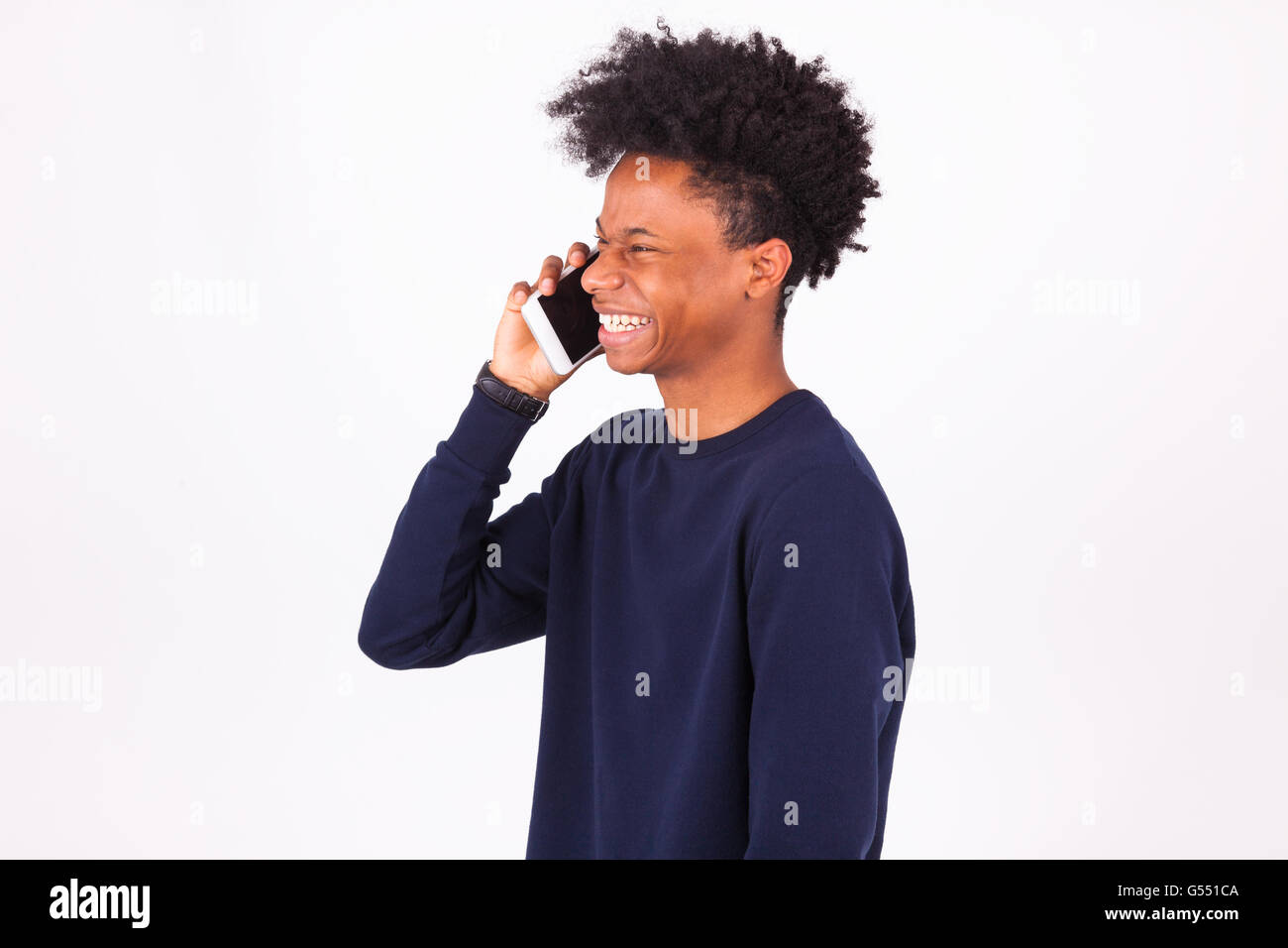 Young African American man making a phone call on her smartphone ...