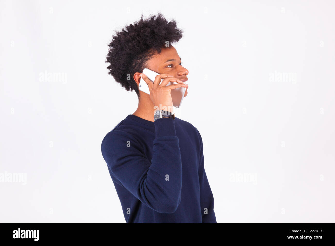 Young African American man making a phone call on her smartphone ...