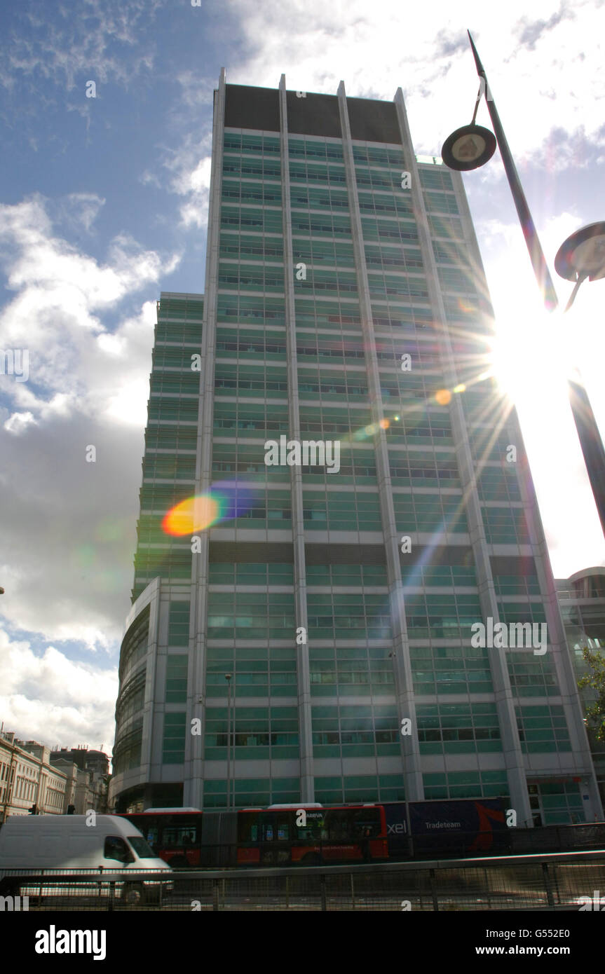 Glass tower block in London with sunlight flaring into lens ...