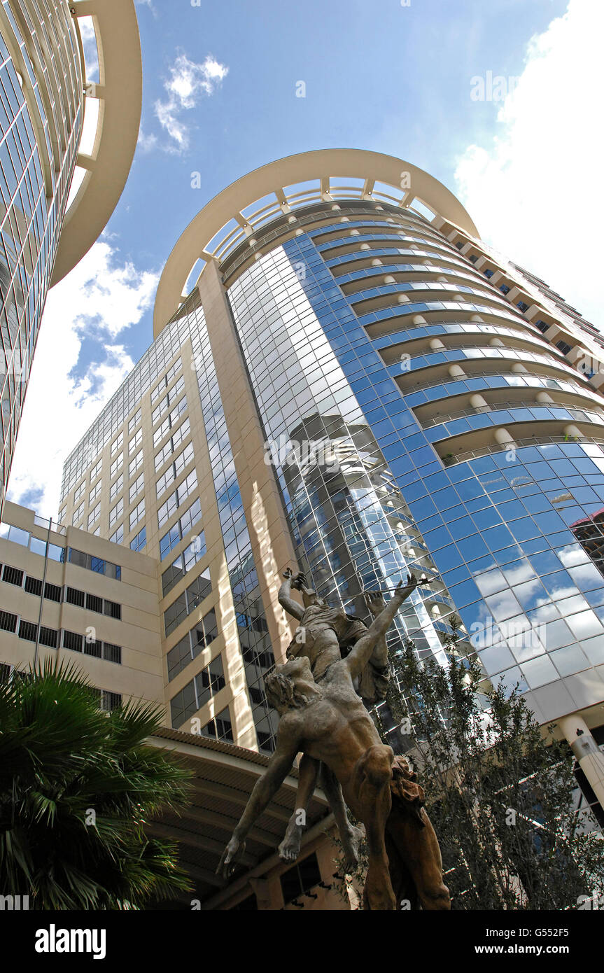 Architecture tall circular glass office buildings soaring up into a ...