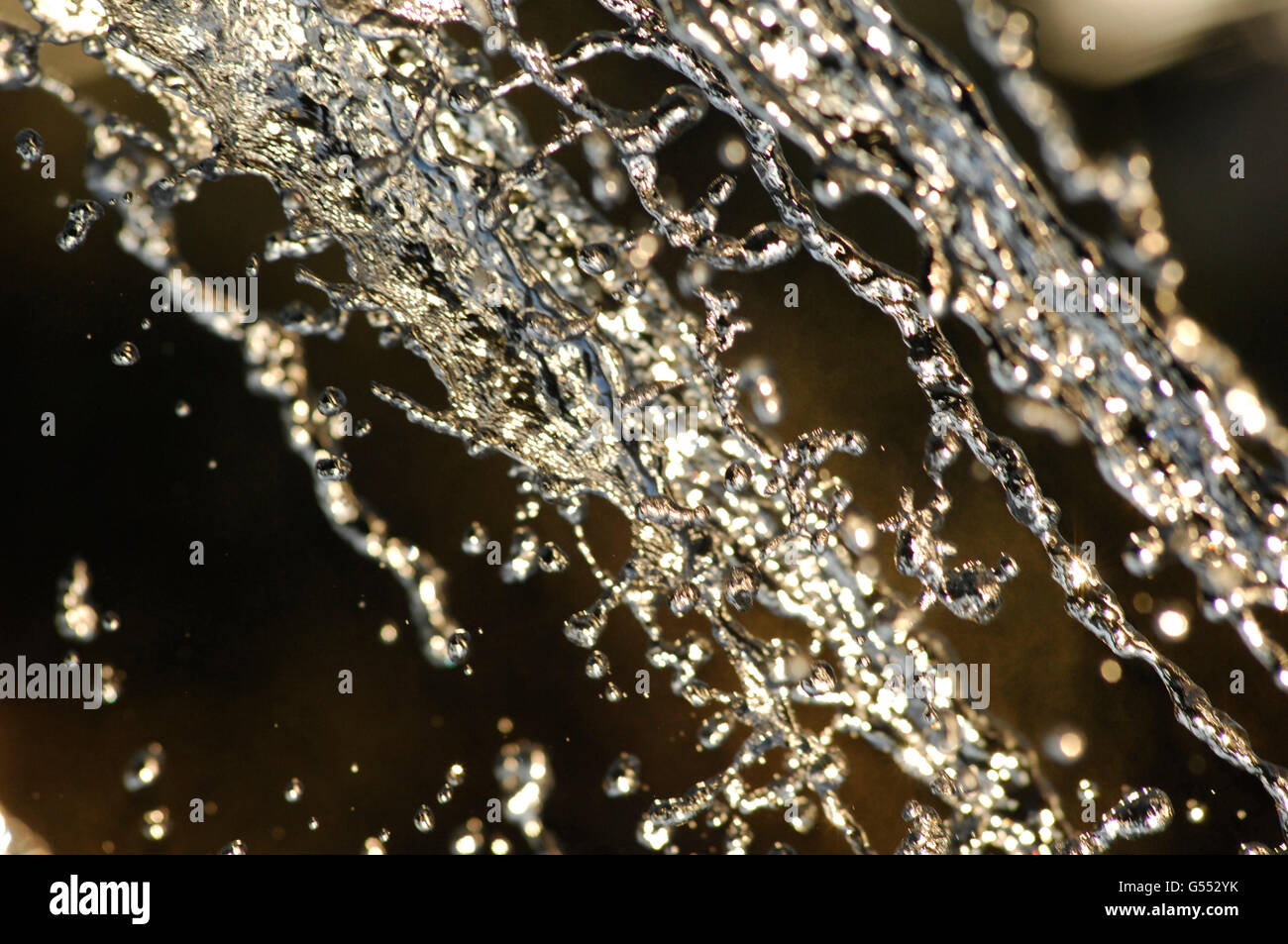 Capturing flowing sparkling water in midair Stock Photo - Alamy