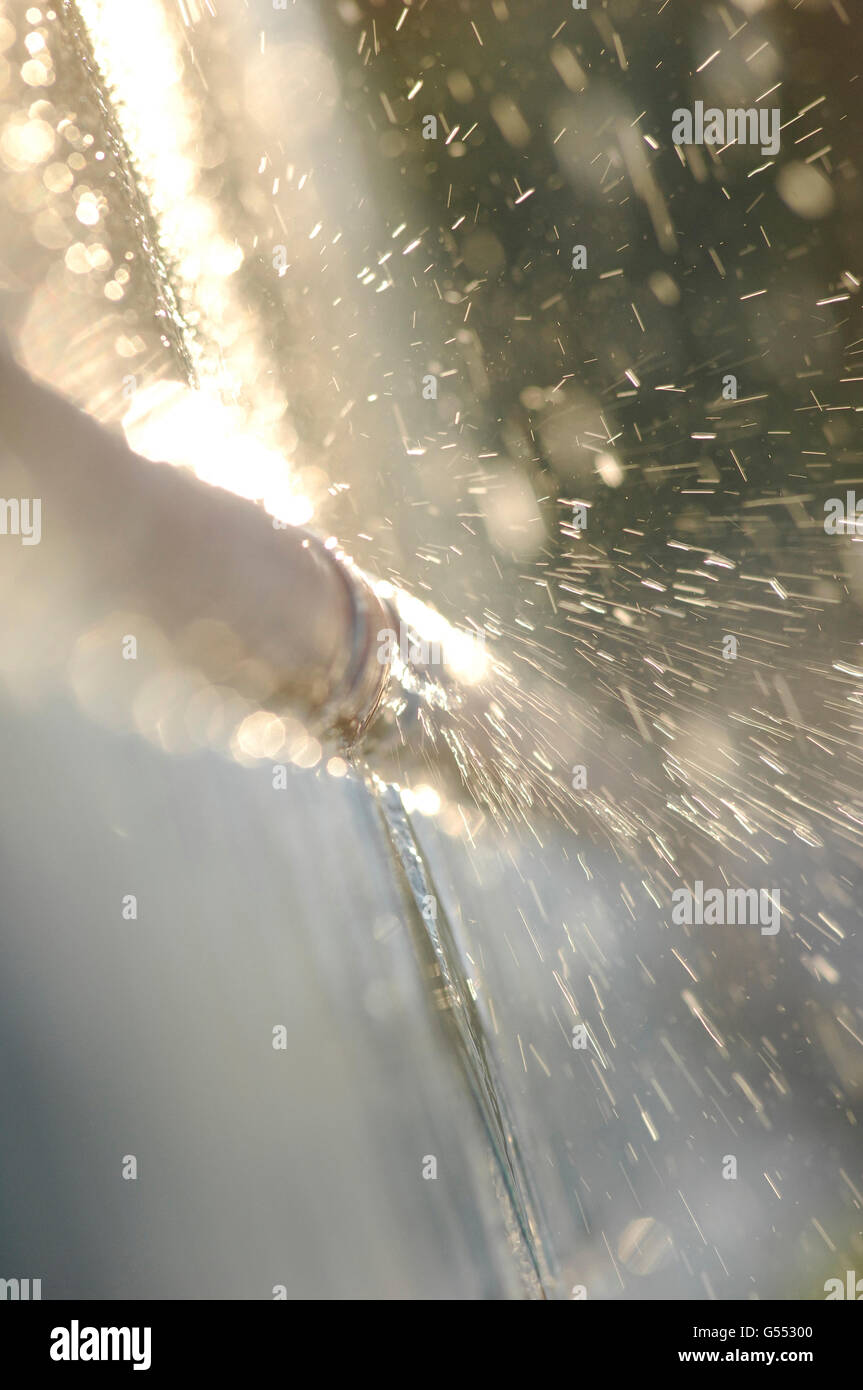 Capturing flowing sparkling water in midair Stock Photo - Alamy