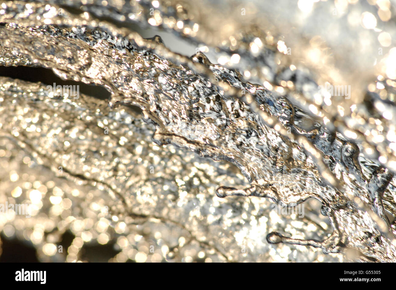 Capturing flowing sparkling water in midair Stock Photo - Alamy