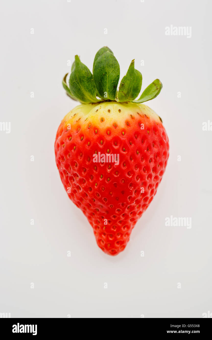Closeup of not fully ripe strawberry Stock Photo - Alamy