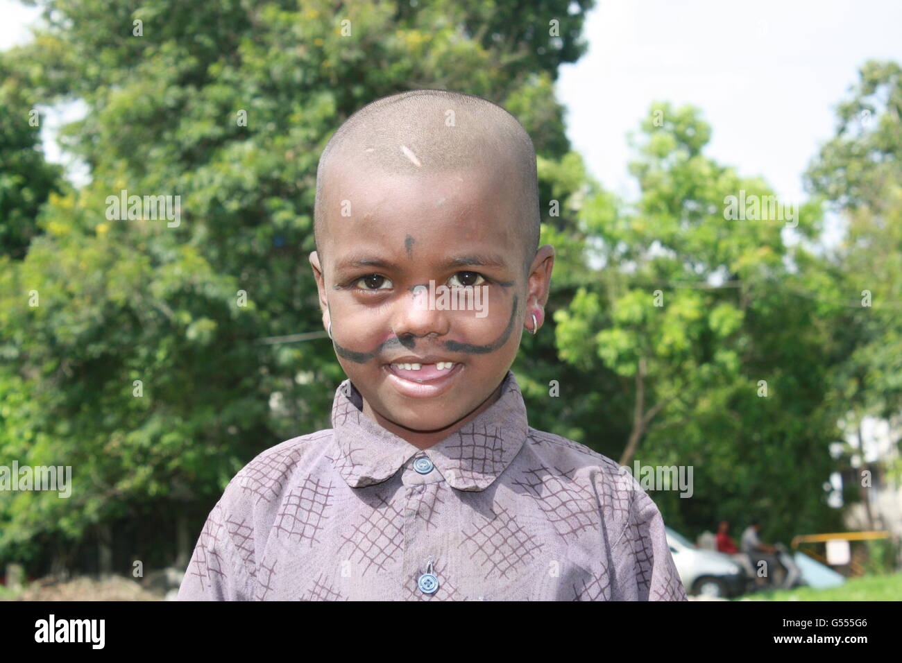A portrait of a poor streetside boy in India Stock Photo - Alamy
