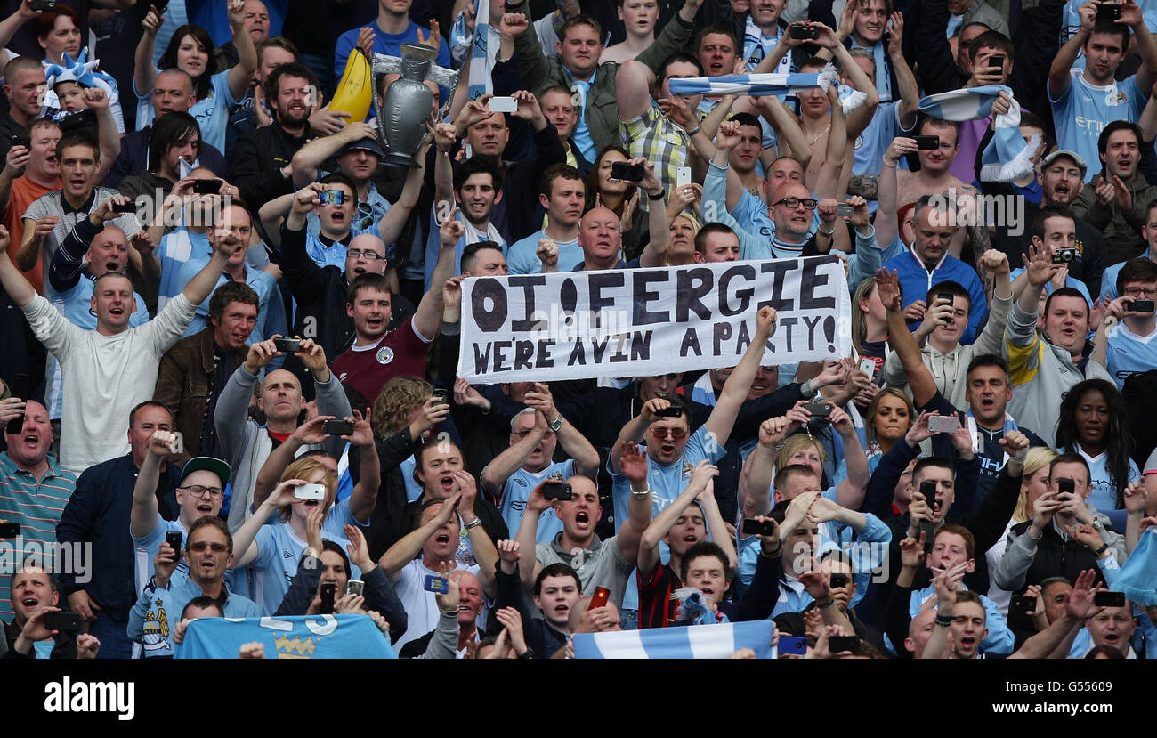 Manchester City fans celebrate winning the Premier League during the ...
