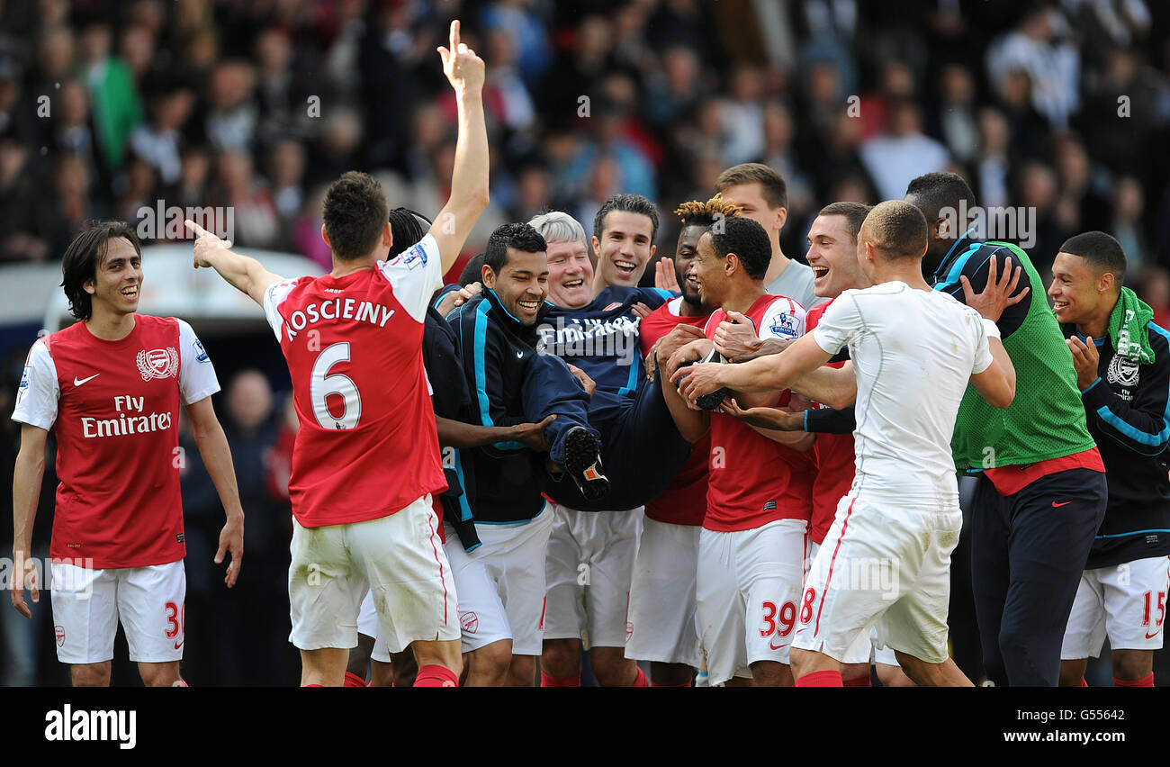 Arsenal's players pick up Assistant Manager Pat Rice after his last ...