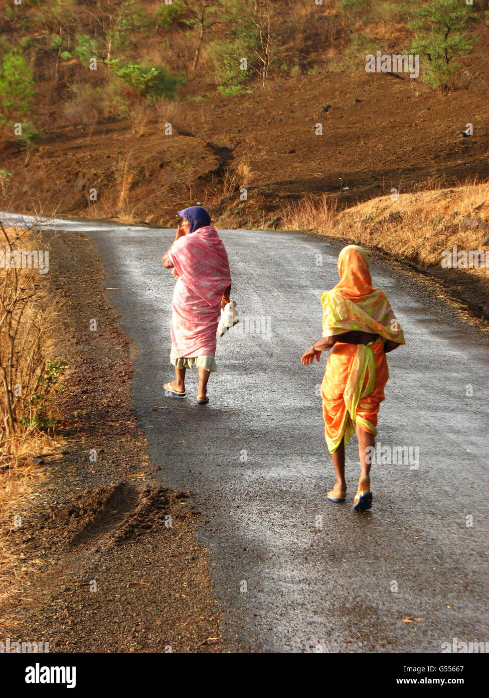 Village women walking back to their home Stock Photo - Alamy