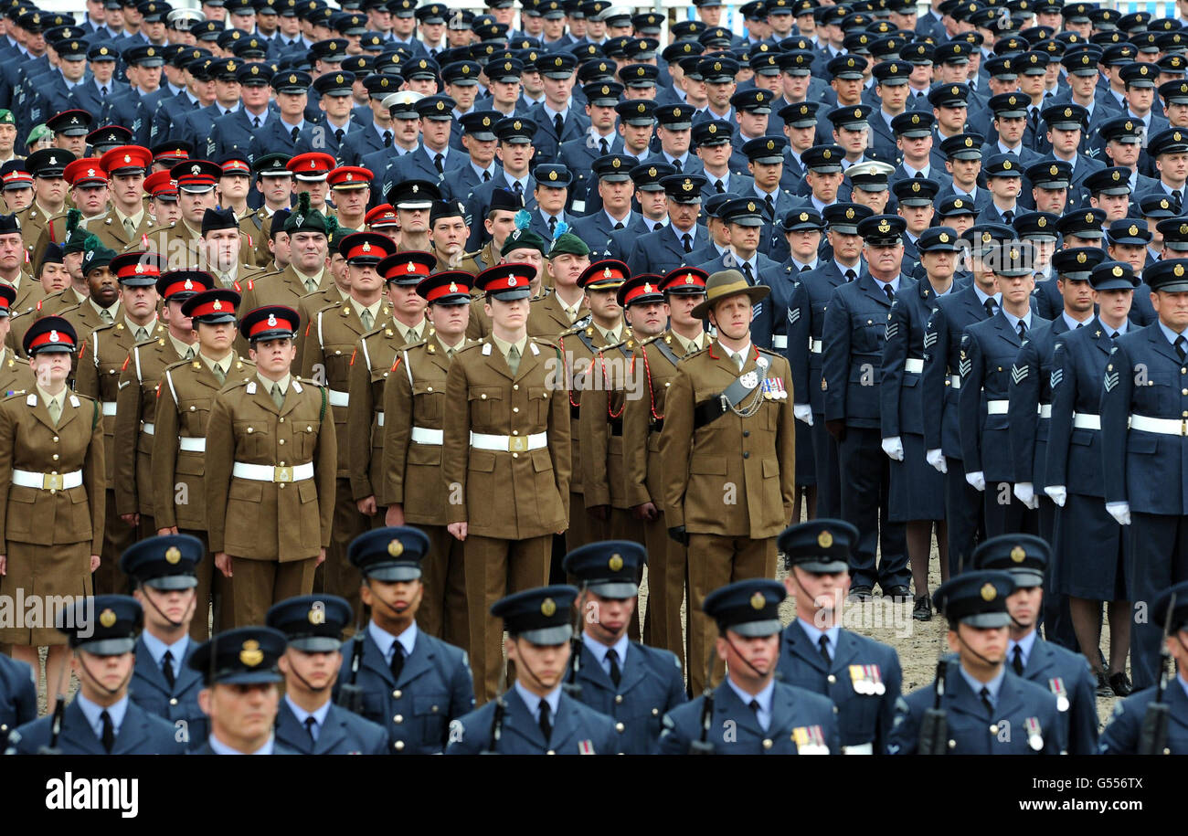 Members of the armed forces line up in formation during the Queen's ...