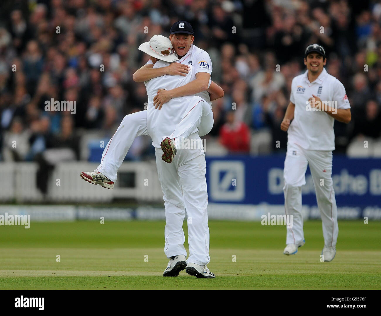 England's Jonny Bairstow is lifted off his feet by Stuart Broard after ...
