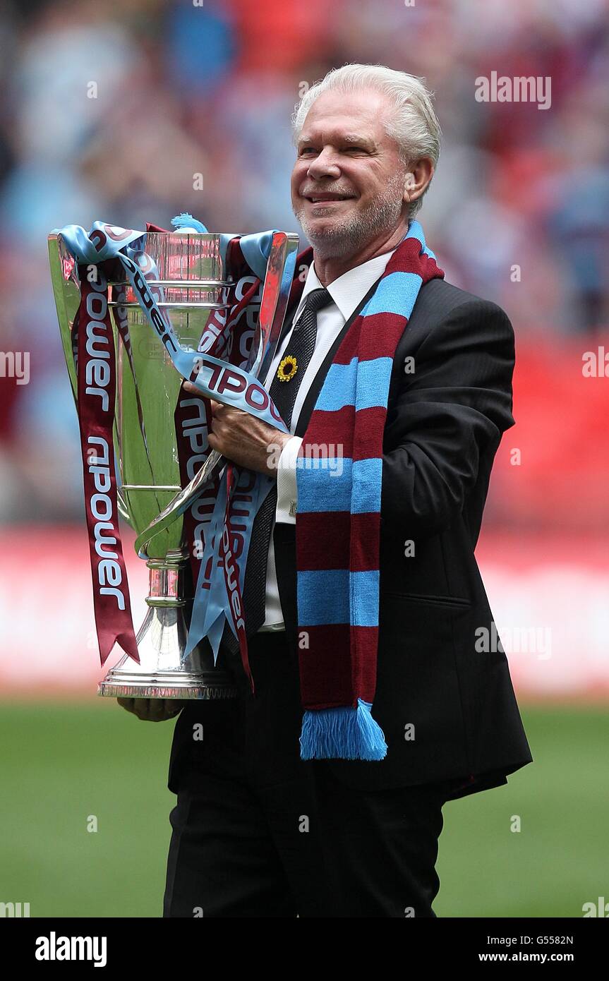 West Ham United co-owner David Gold celebrates with the trophy, after ...