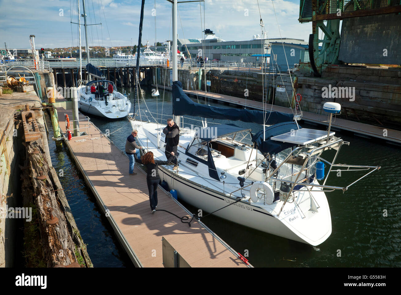 Sailboats in lock connecting Bassin Louise marina with St. Lawrence ...
