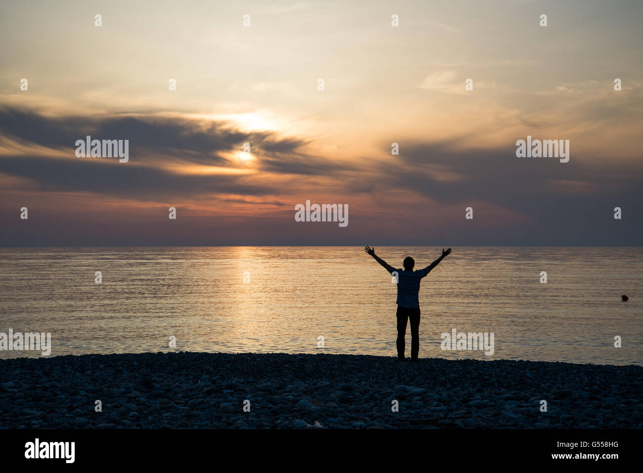 Silhouette of Man Raising His Hands or Open arms when sun rising up ...