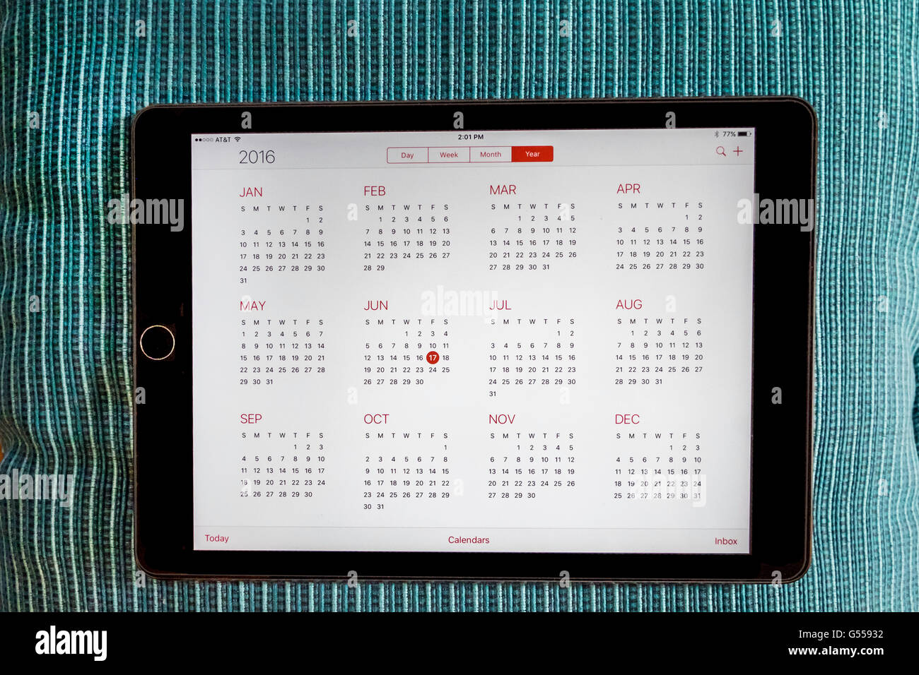An Apple iPad Air showing a yearly calendar on the screen. USA Stock ...