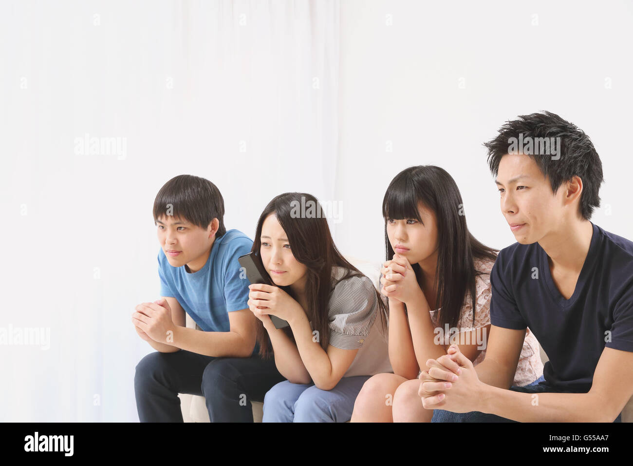 Group of Japanese supporters in the living room Stock Photo - Alamy