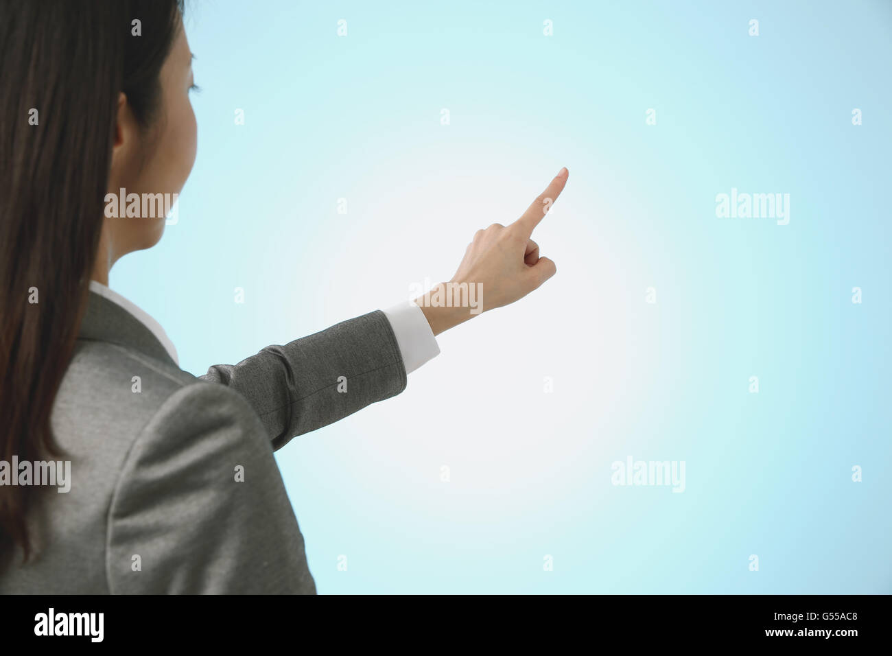 Japanese woman performing touch gesture Stock Photo - Alamy