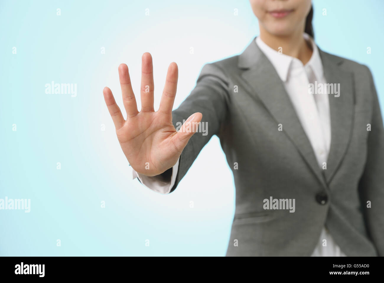 Japanese woman performing touch gesture Stock Photo - Alamy